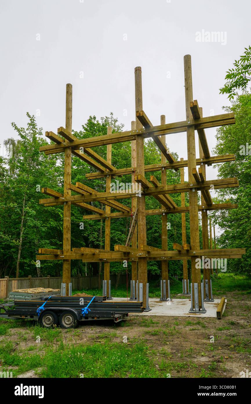 Large wooden frame structure under construction, featuring beams, posts ...