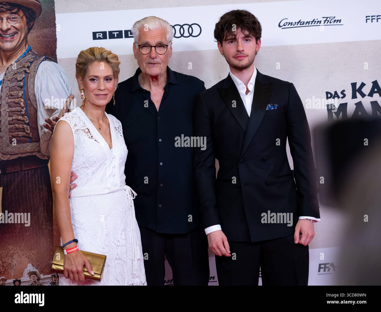 12 August 2025, Bavaria, Munich: Julia Schütze (l-r), Sky du Mont and Fayn Neven du Mont attend ...