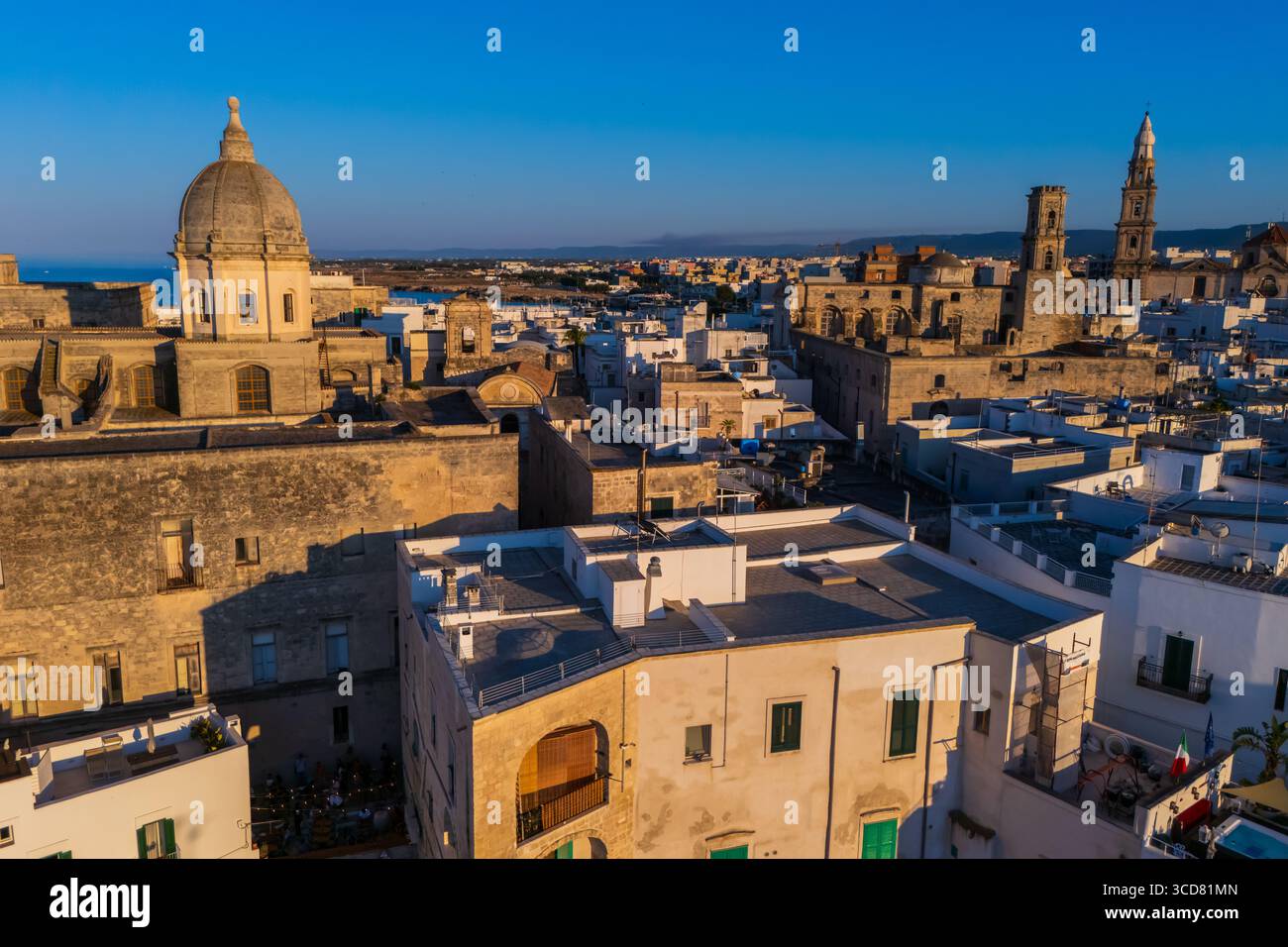 Aerial view of old town walls and Santa Teresa church at sunset ...