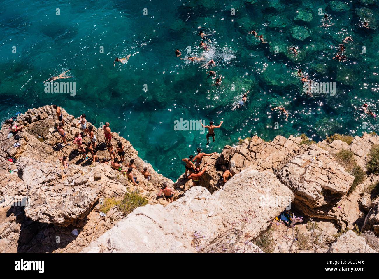 People swimming and jumping into the sea from Pendma Chiatt (Pietra ...