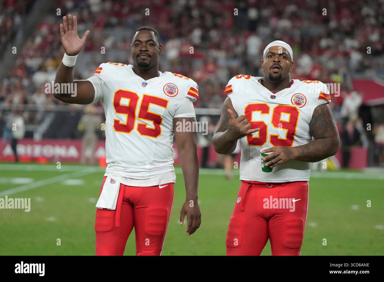 Kansas City Chiefs defensive tackle Chris Jones (95) and defensive tackle Mike Pennel (69) warms ...
