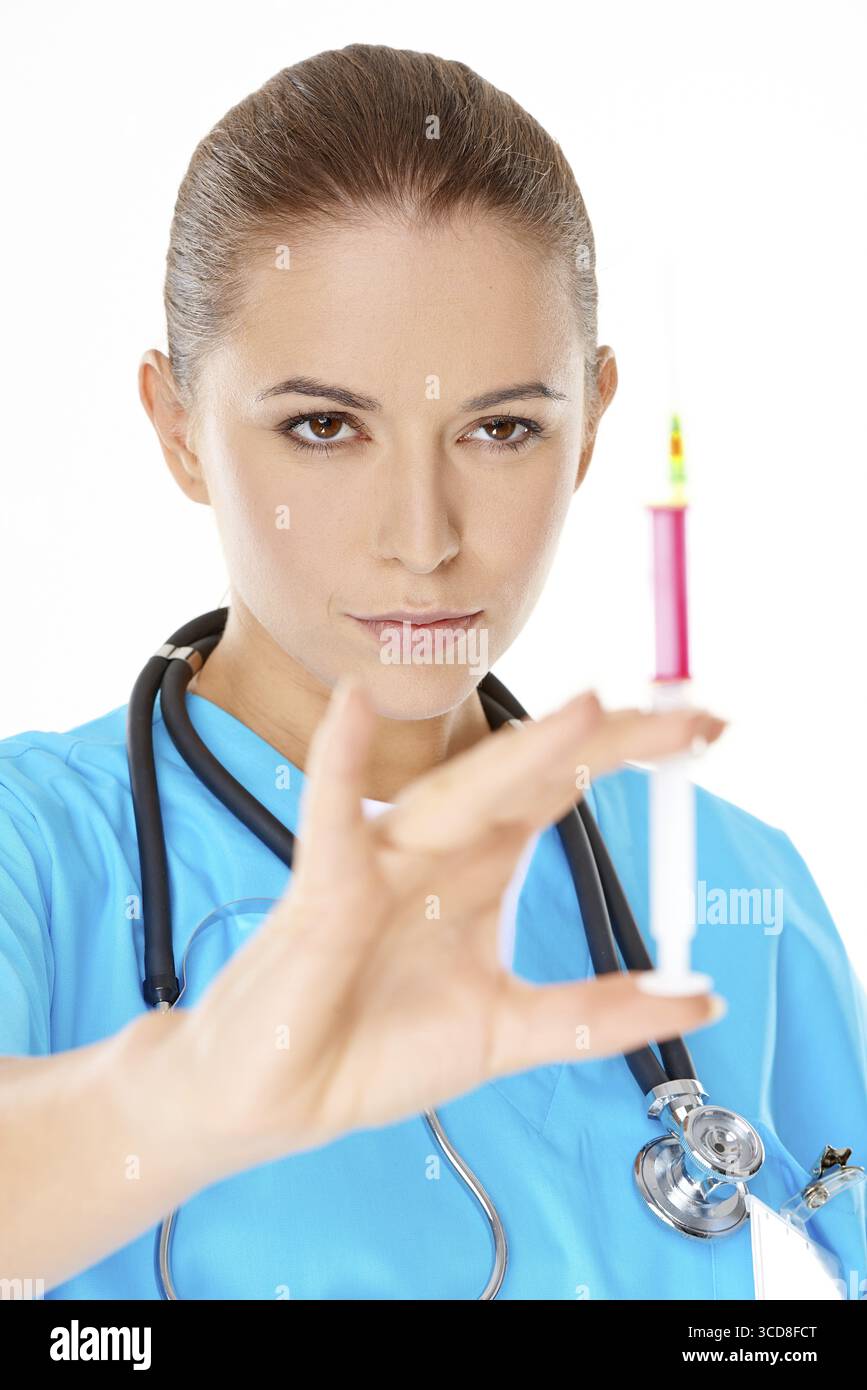 Female doctor carefully preparing injection hi-res stock photography ...