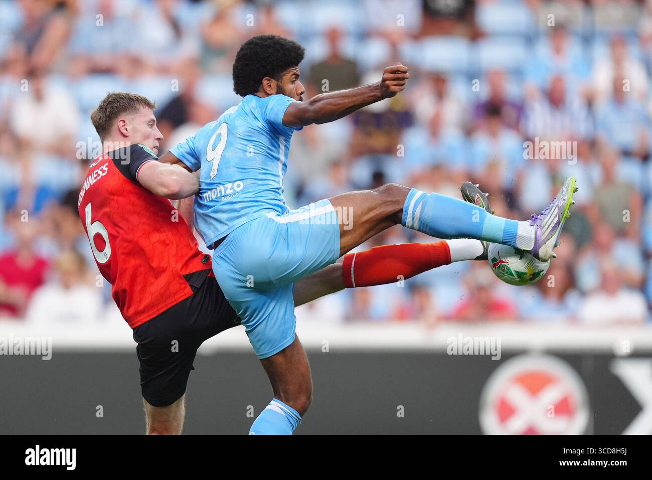 Luton Town's Mark McGuinness (left) and Coventry City's Ellis Simms ...