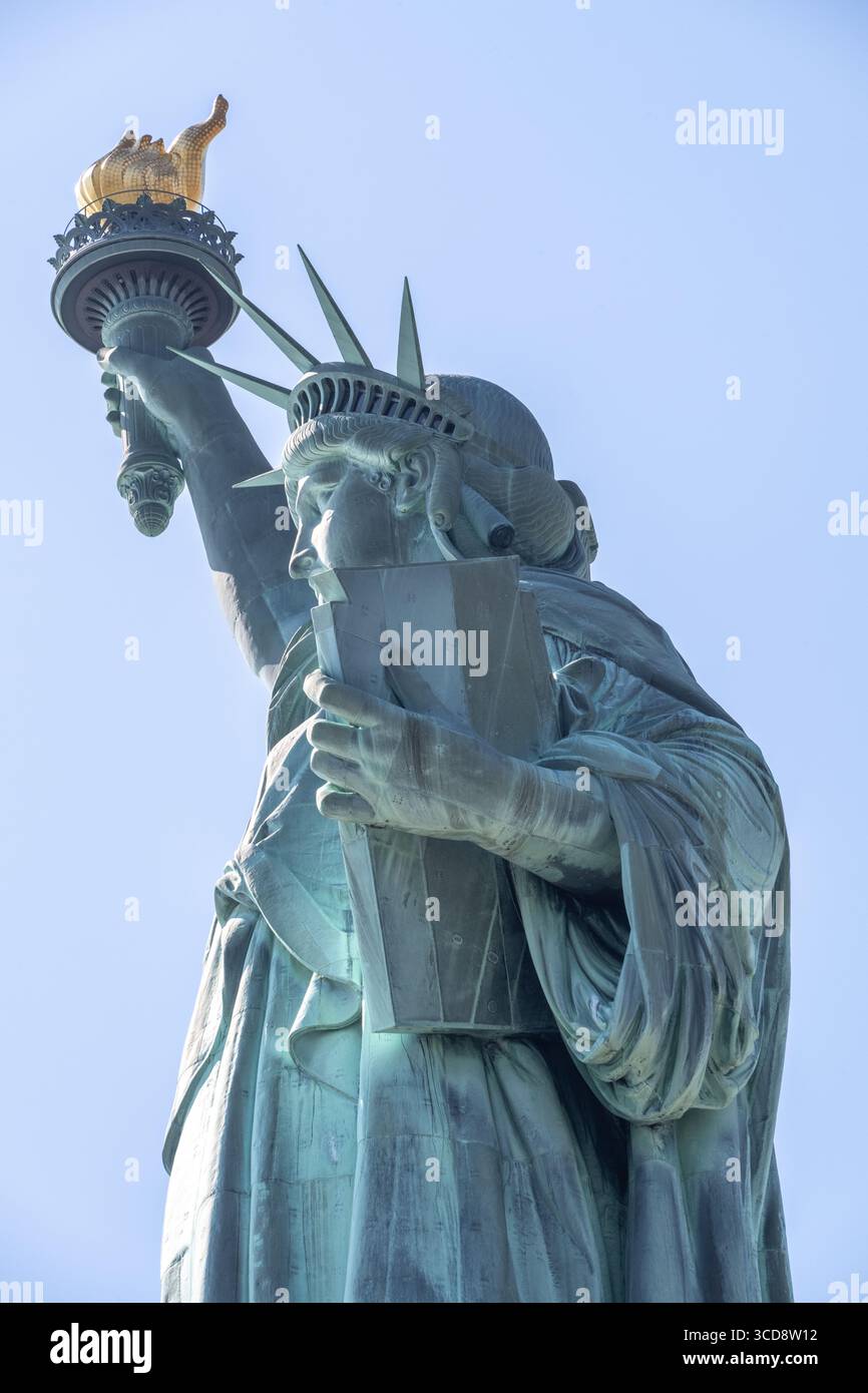 torch, statue and tabula ansata view of the Statue of Liberty in the ...
