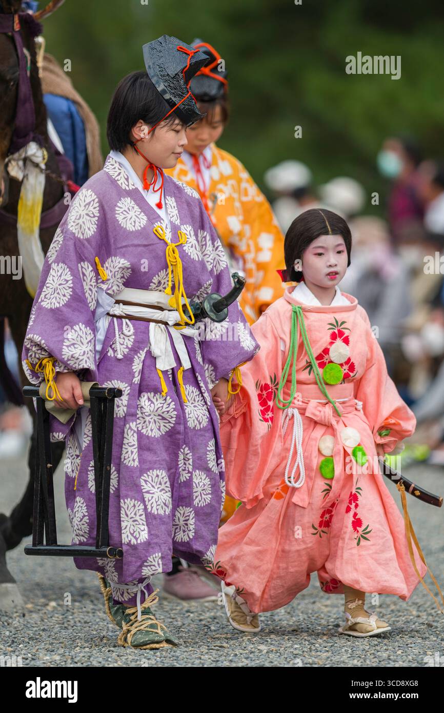 Woman and girl dressed in Kamakura Period attire walking in the ...