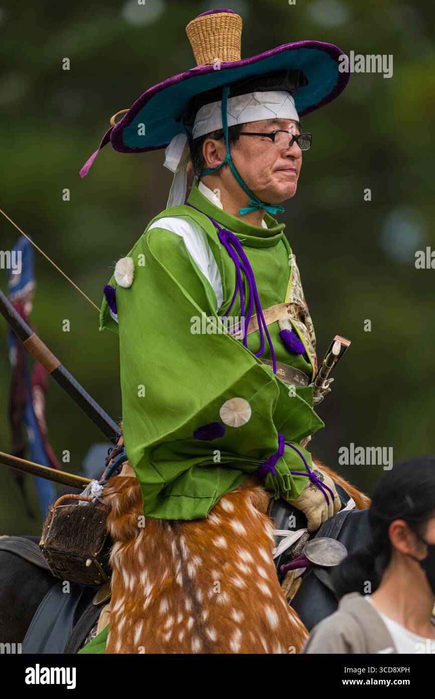 Japanese men dressed as an Archer Samurai on horseback in procession of ...