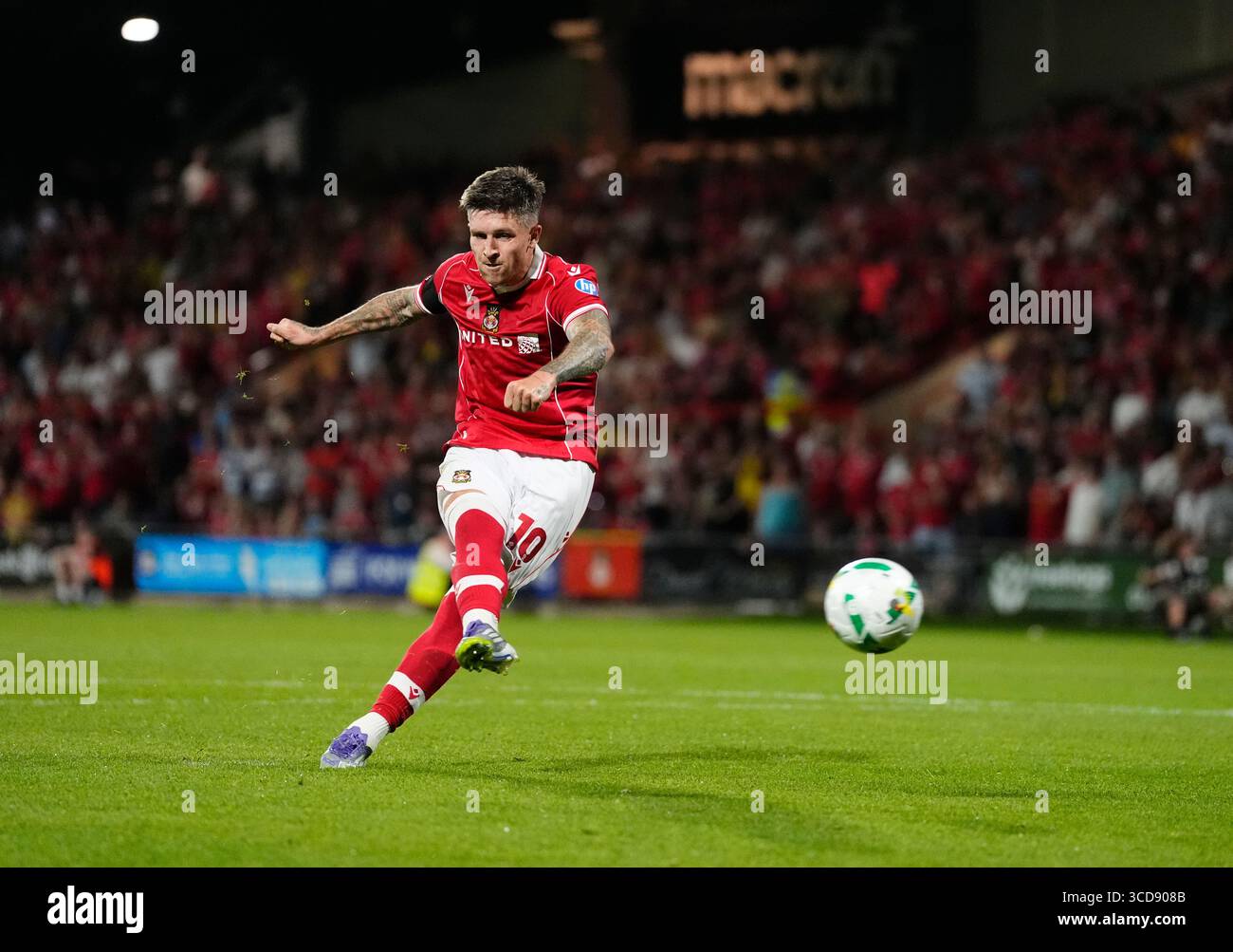 Wrexham's Josh Windass scores during a penalty shootout during the ...