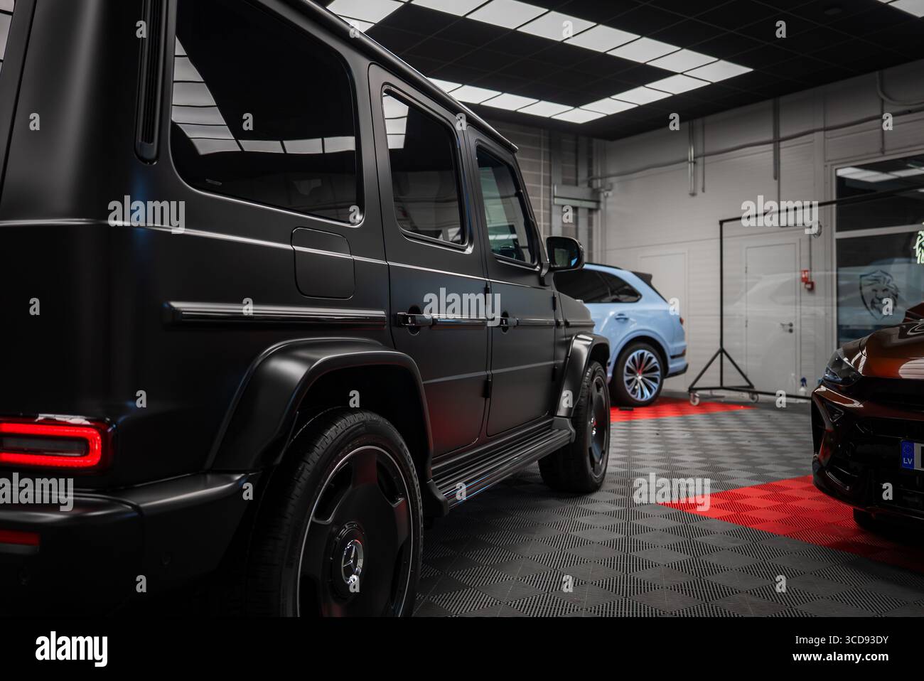 Black Mercedes AMG G Class in Modern Indoor Showroom Setting Stock ...
