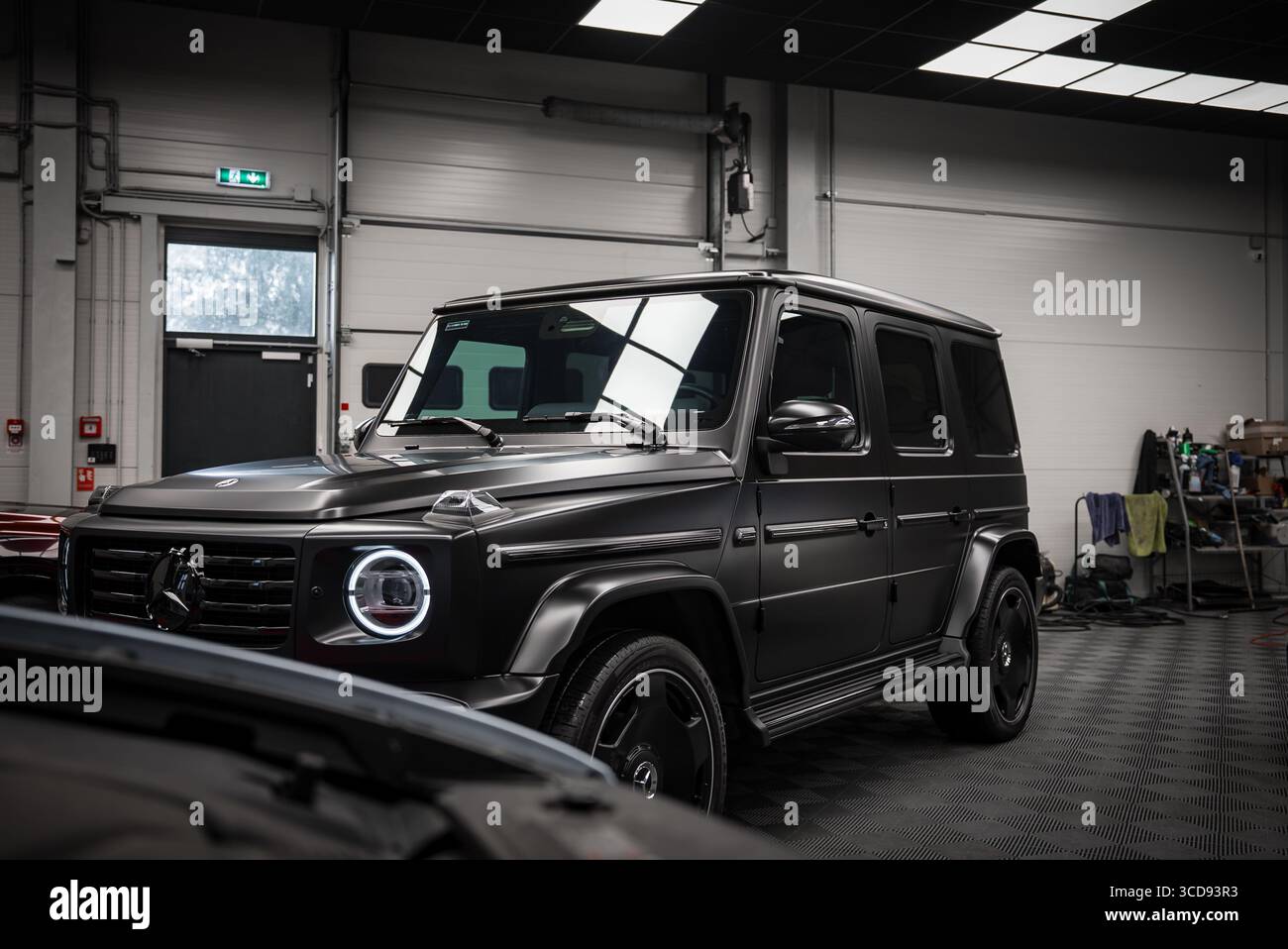 Matte Black Mercedes AMG G Class SUV in Indoor Automotive Setting Stock ...