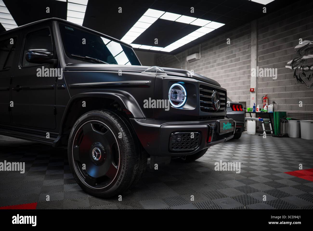 Close Up of Black Mercedes AMG G Class in Modern Showroom Setting Stock ...