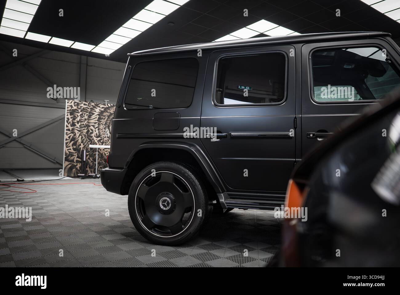 Matte Black Mercedes AMG G Class SUV in Indoor Showroom Setting Stock ...