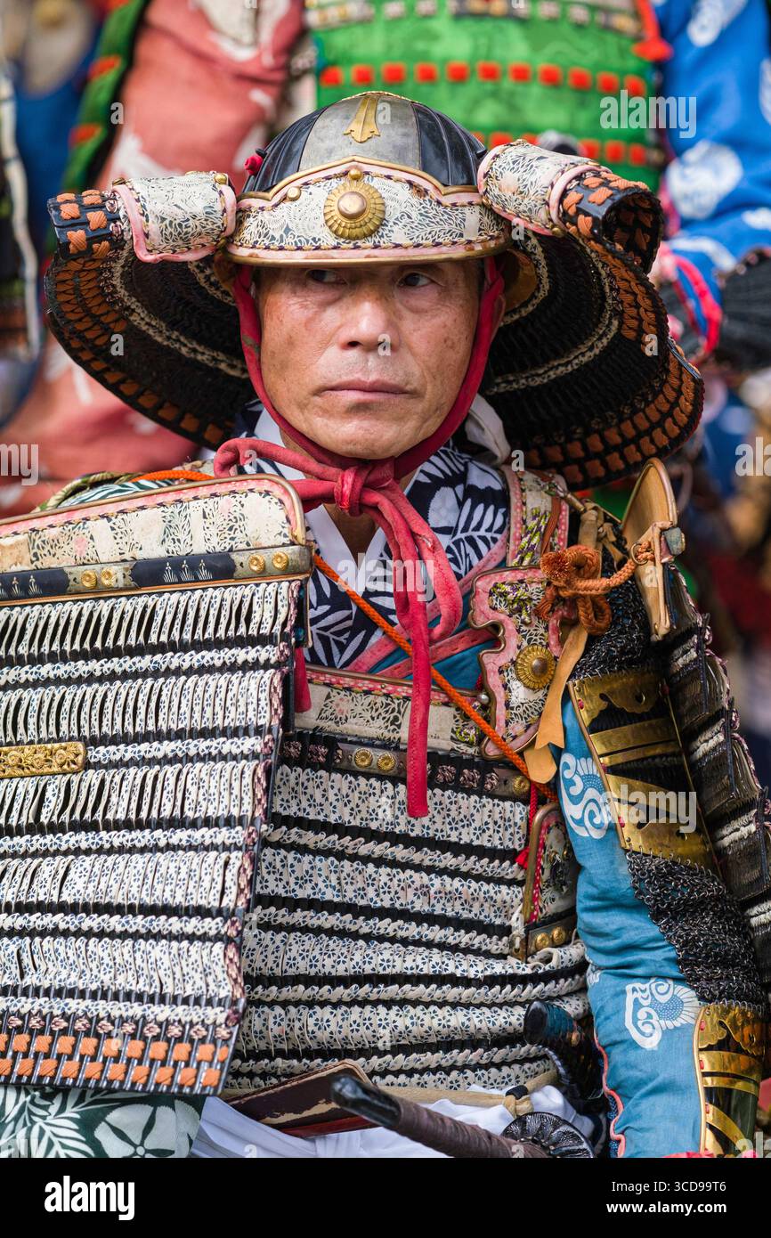 Mature Japanese man dressed in Yoshino Period samurai armor posing for ...