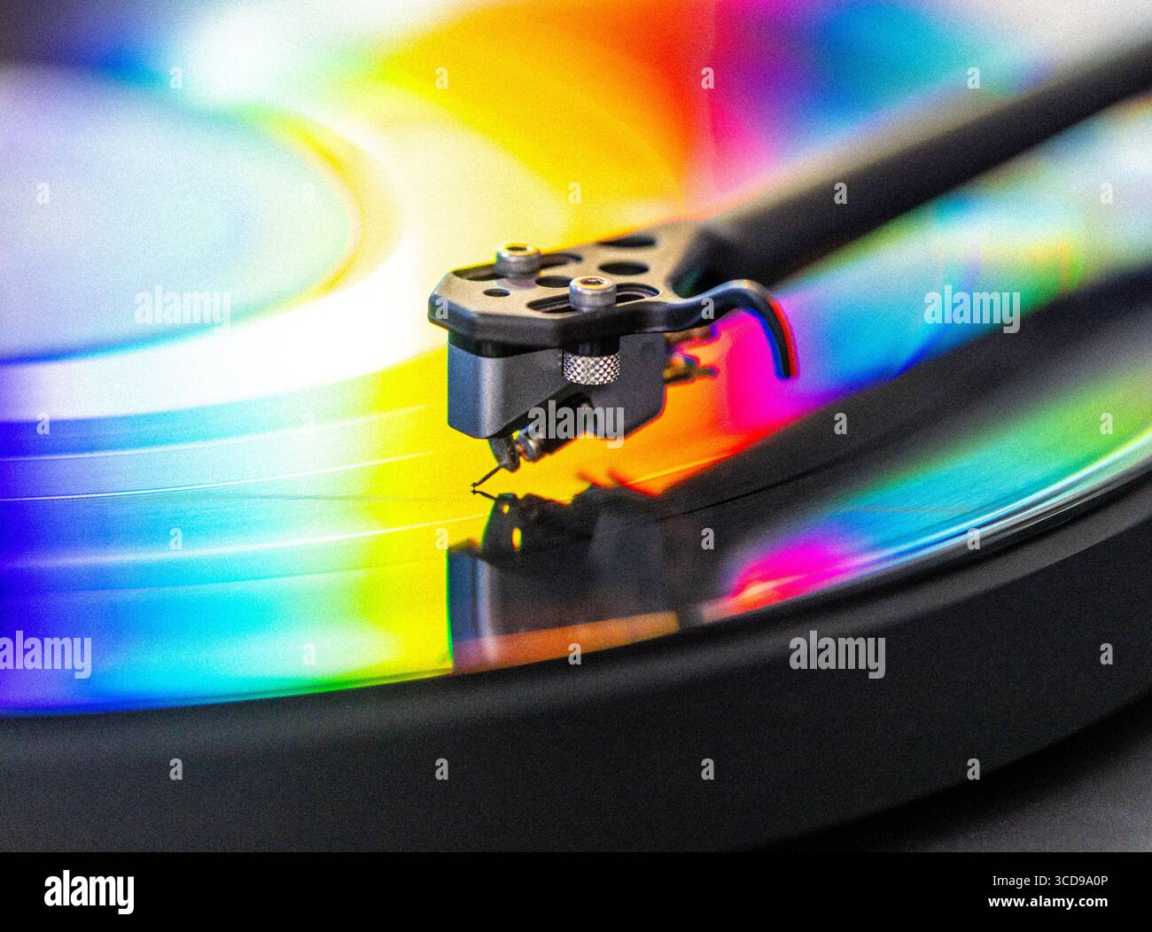 wonderful bright rainbow colored lights reflect off a vinyl record ...