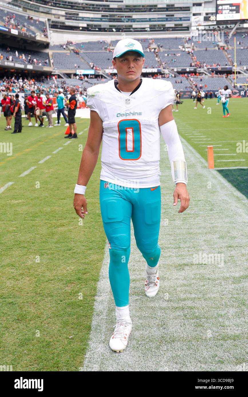 Miami Dolphins quarterback Zach Wilson (0) walks off the field after an ...