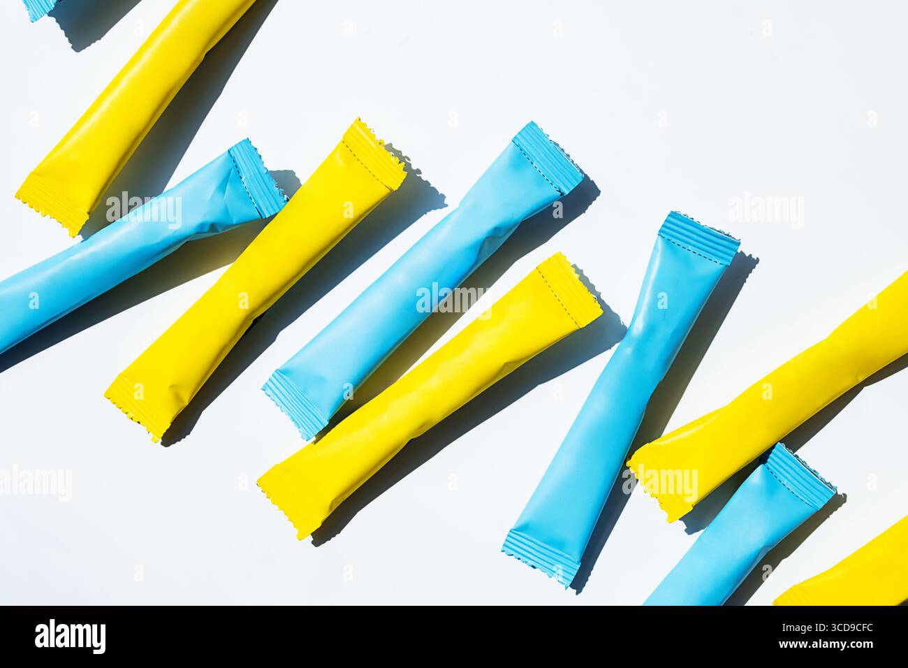 Yellow and blue stick pack energy drink and instant coffee mockup ...