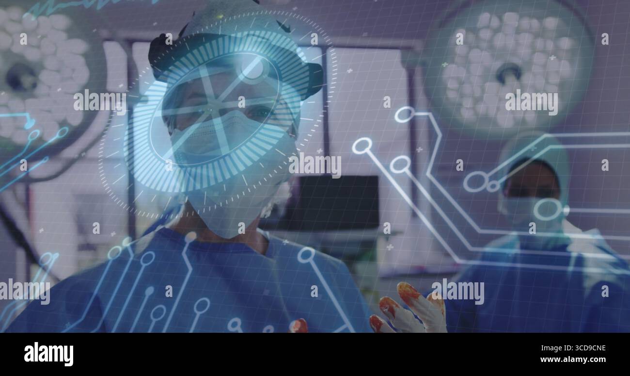 Lead surgeon in scrubs and headlight conducting surgery in operating ...