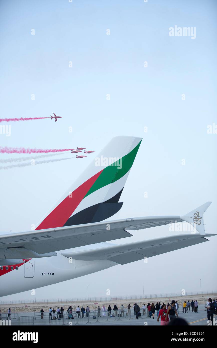 Emirates Airbus A380 tail with UAE flag colors, aerobatic jets ...