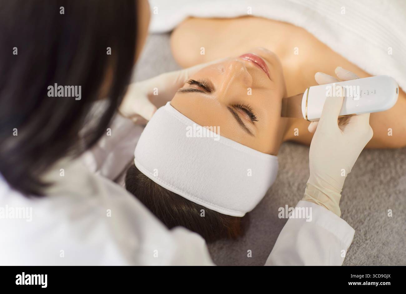 Dermatologist doctor doing mechanical female face skin cleaning with ...