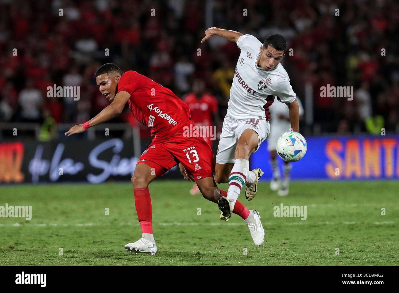 Mateo Castillo of Colombia's America, left, and Kevin Serna of Brazil's ...