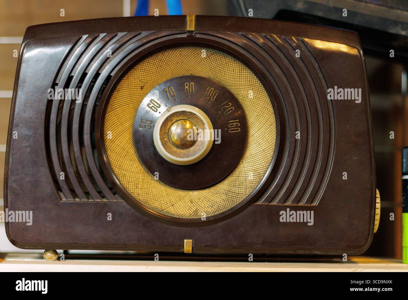 A view of very colorful antique broadcast radios from different eras ...