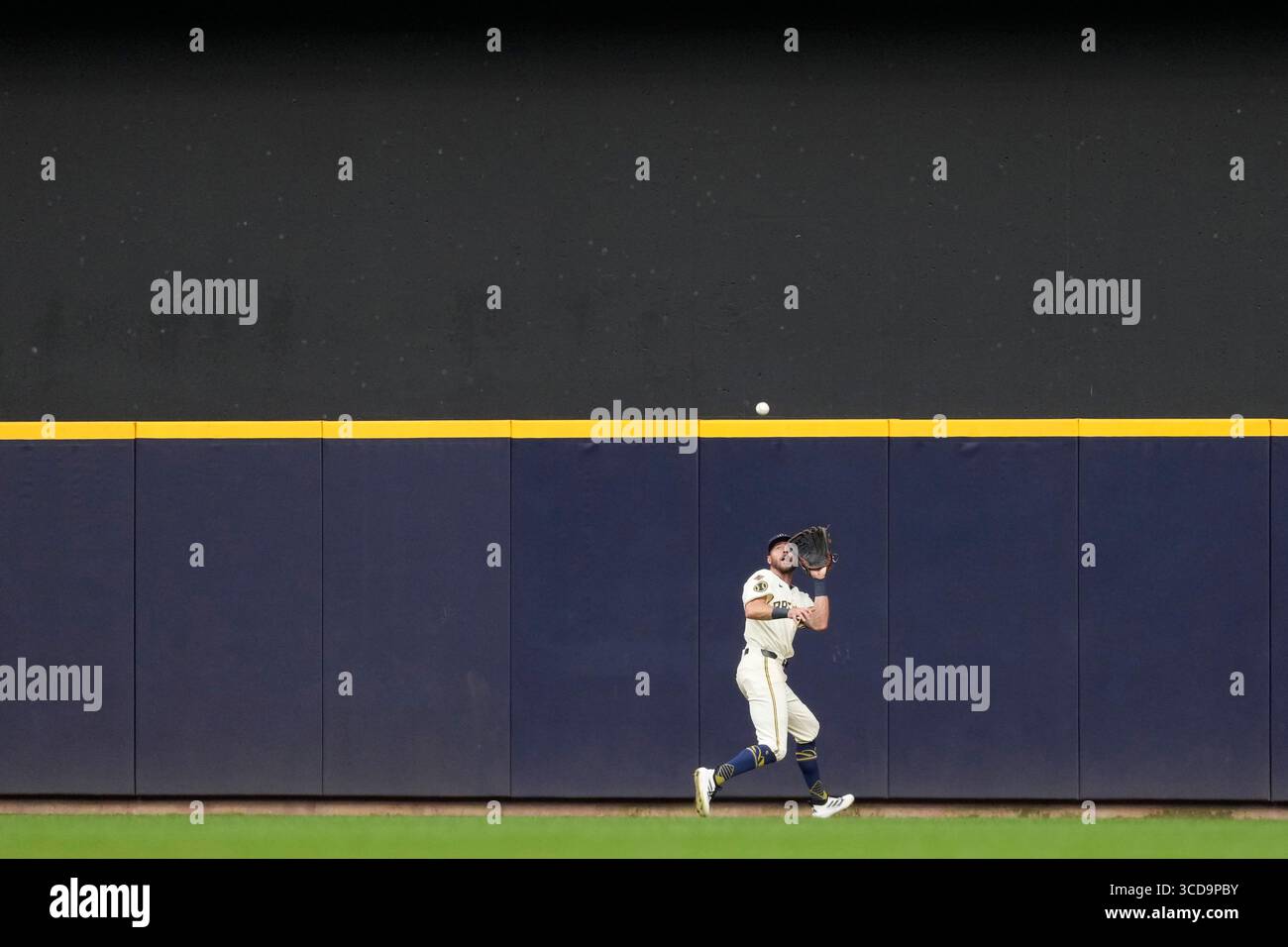 Milwaukee Brewers' Brandon Lockridge catches a fly ball during a ...