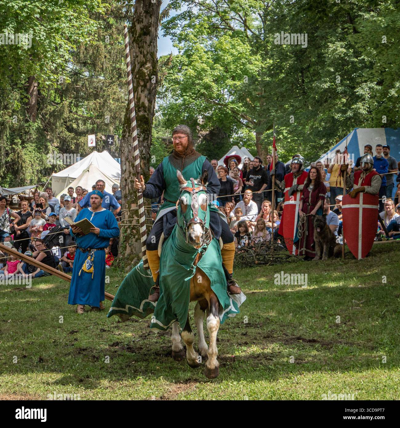 Festival of medieval culture. Knight on horseback with a lance in his ...