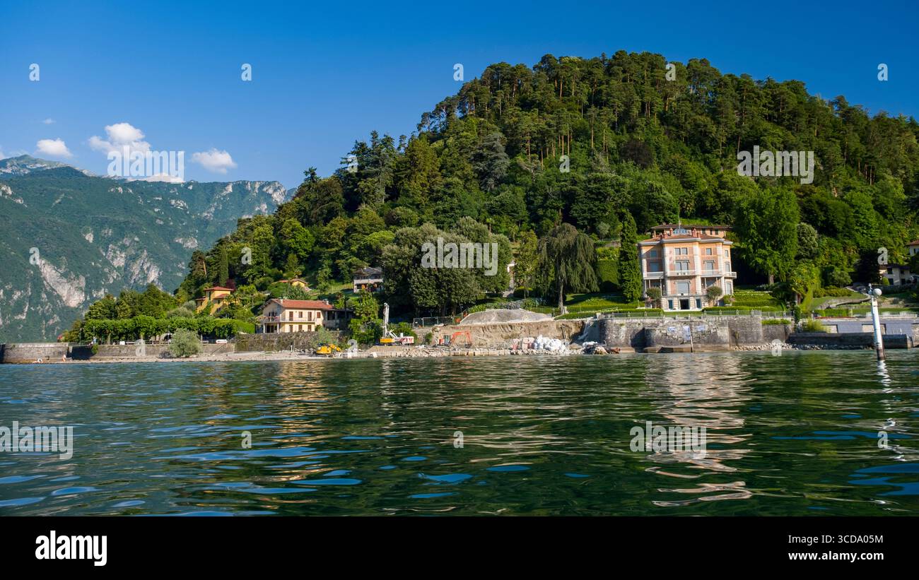 Construction equipment altering the shoreline of Lake Como, Bellagio ...