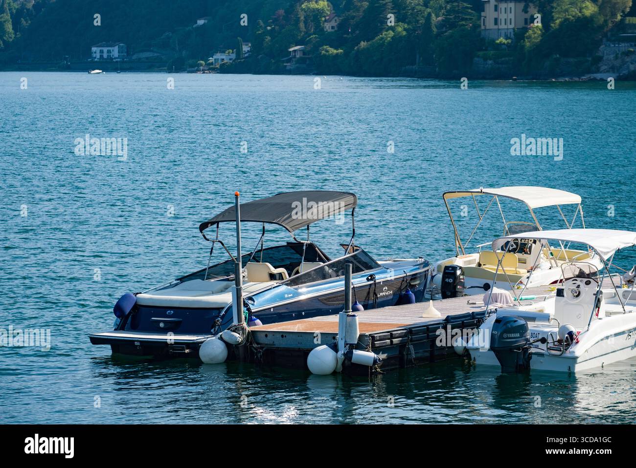 Motorboats moored to floating dock on Lake Como, Province of Como ...