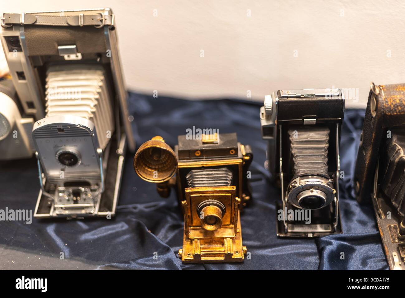 Collection of vintage folding cameras displayed in an antique store in ...