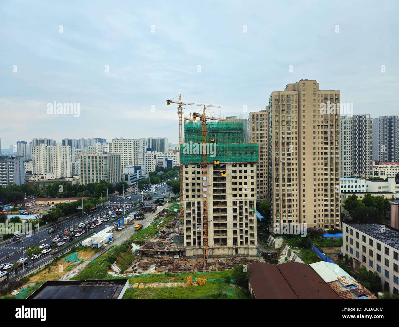 High rise building under construction scaffolding hi-res stock ...