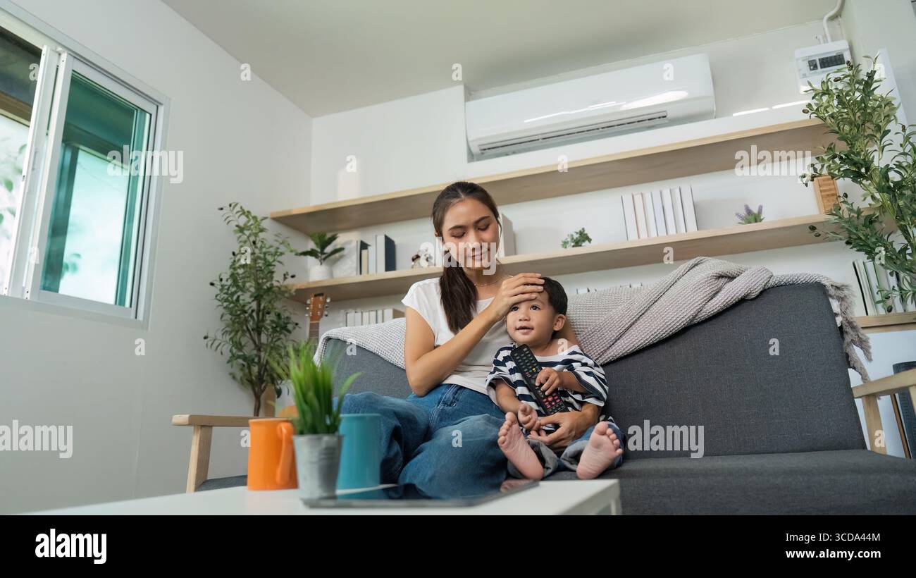 Affectionate Care: Mother Comforting Child While Working Stock Photo ...