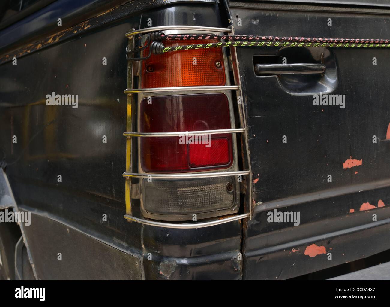 Closeup stainless steel bar cage used to protect taillight of a pickup ...