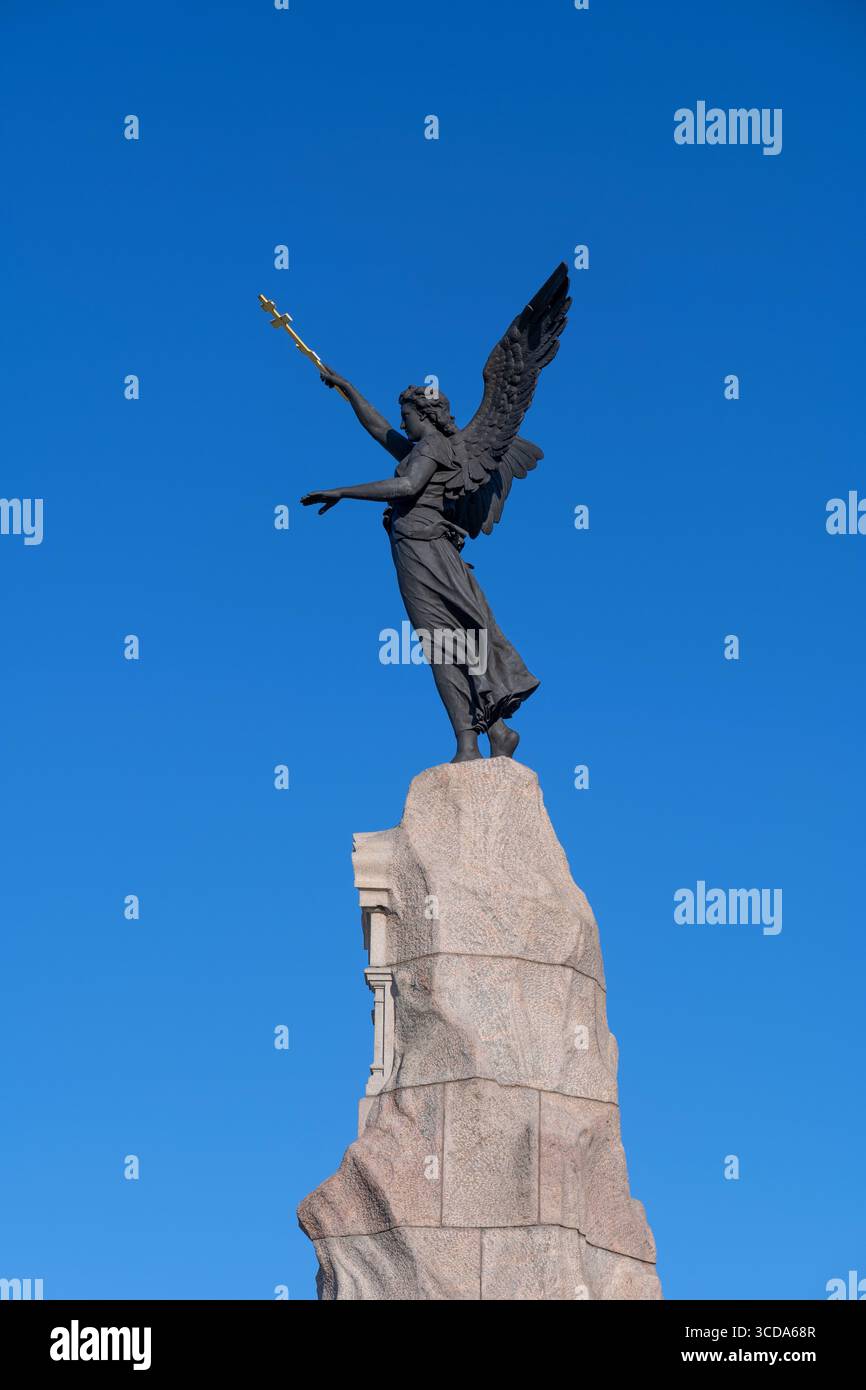 Angel statue holding an Orthodox cross at Russalka Memorial monument ...