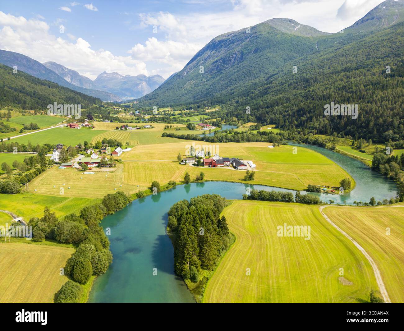 Aerial view of the turquoise Stryn river meanders through the verdant ...