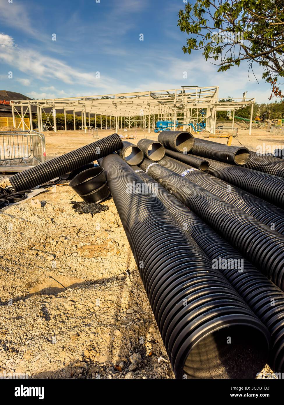 Plastic drainage pipes and steel framework at a construction site of a ...