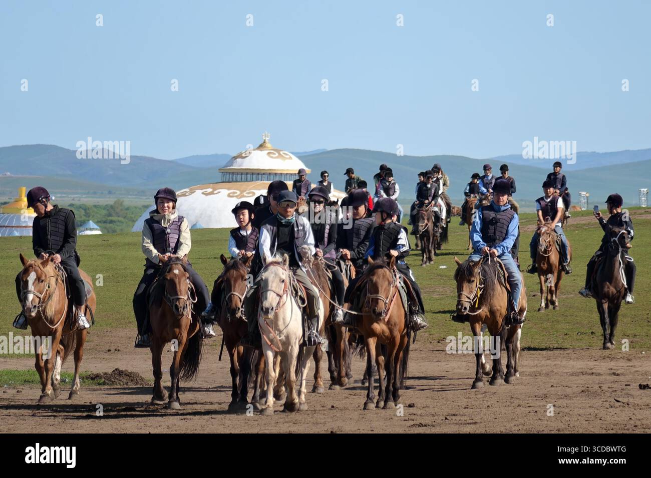 Tourists visit the Hulun Buir Grassland in Hulun Buir City, north China ...