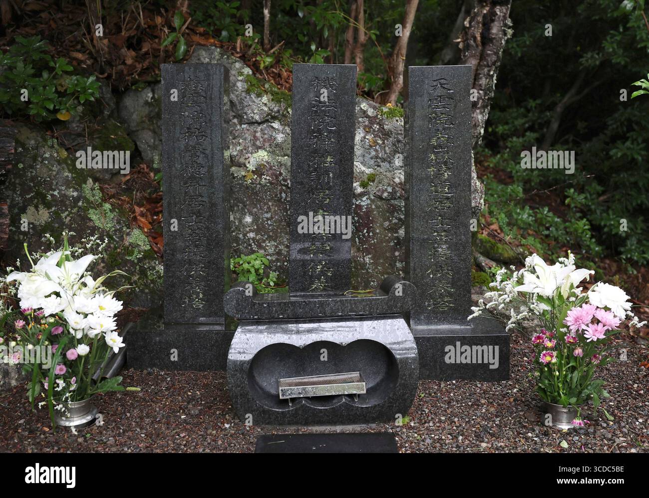 Gravestones for Captain Takahama and others who piloted the plane stand ...