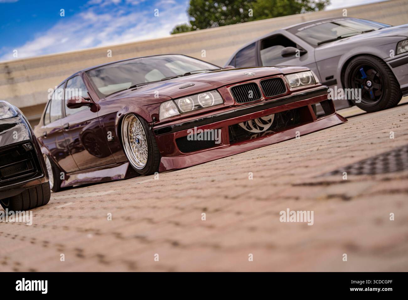 Rome, italy 18 july 2025, low rider bmw sedan parked, showcasing ...