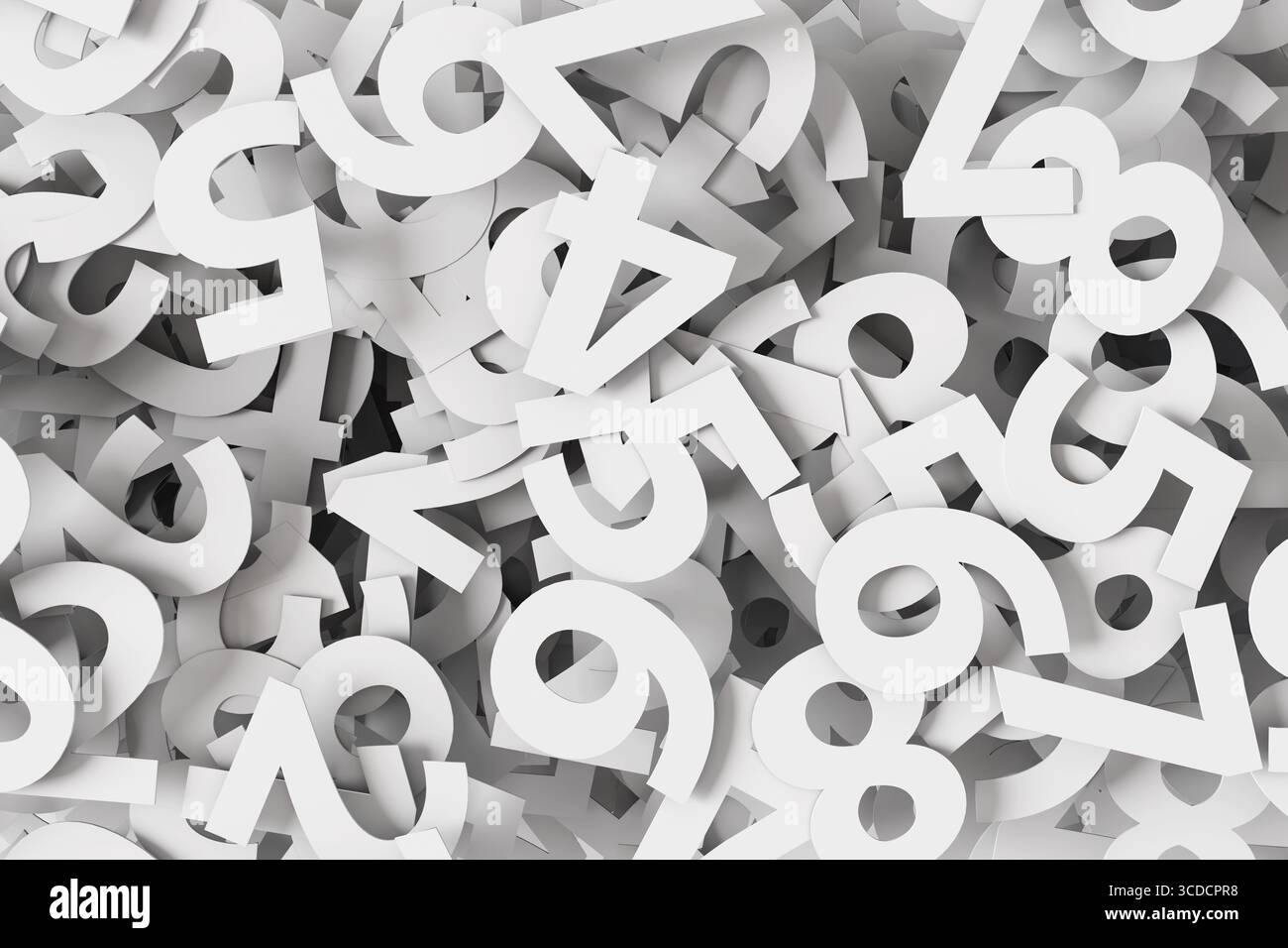 White paper cutouts of numerical digits randomly oriented and scattered ...