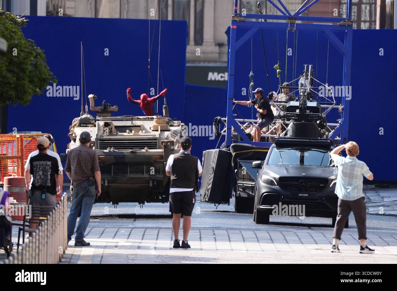A person in a Spider-Man suit during filming on Hutcheson Street in ...