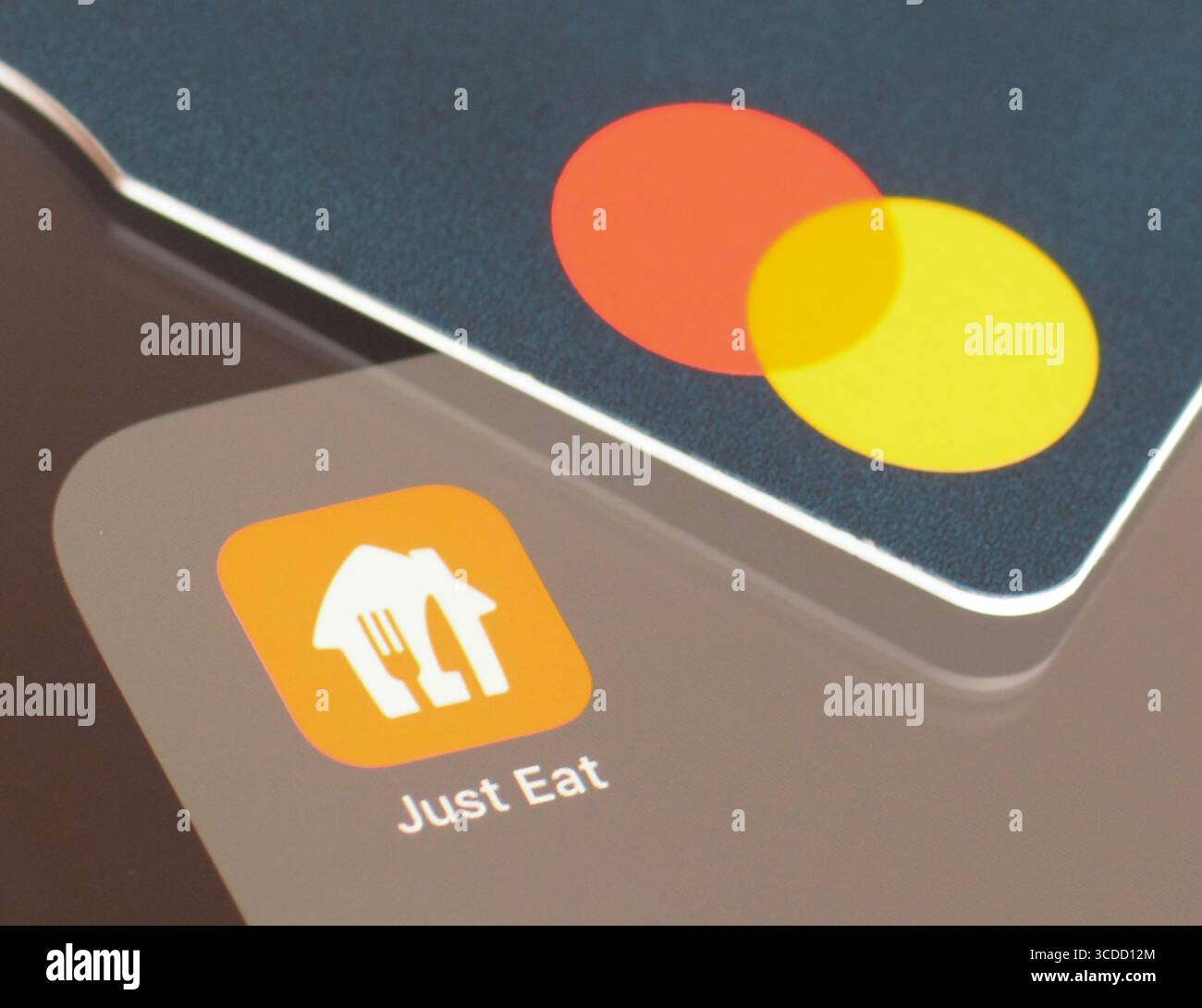 Just Eat food delivery app on smartphone screen with a Mastercard to ...