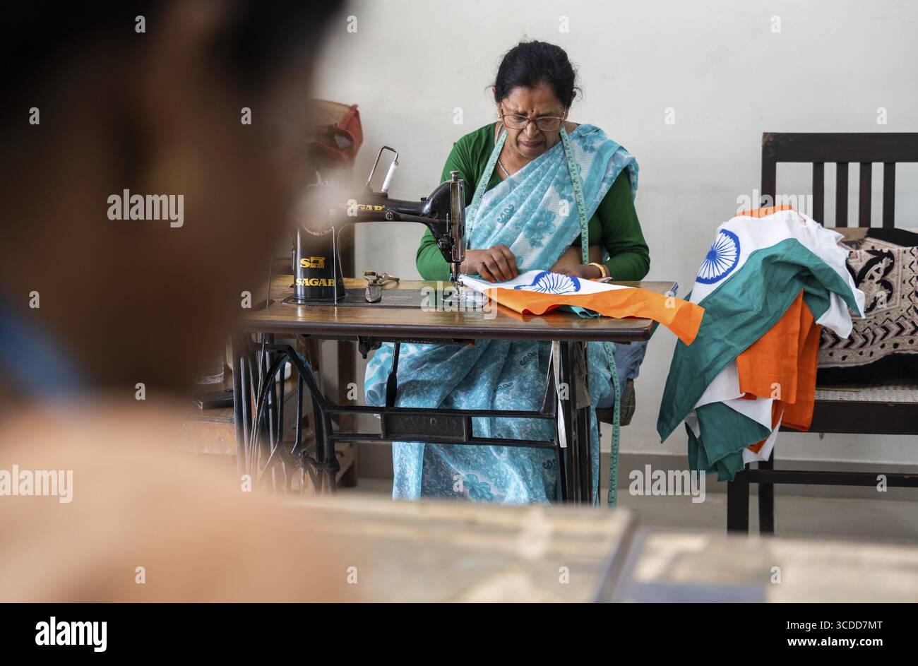 Employees of the Assam Khadi and Village Industries Board stitching in ...