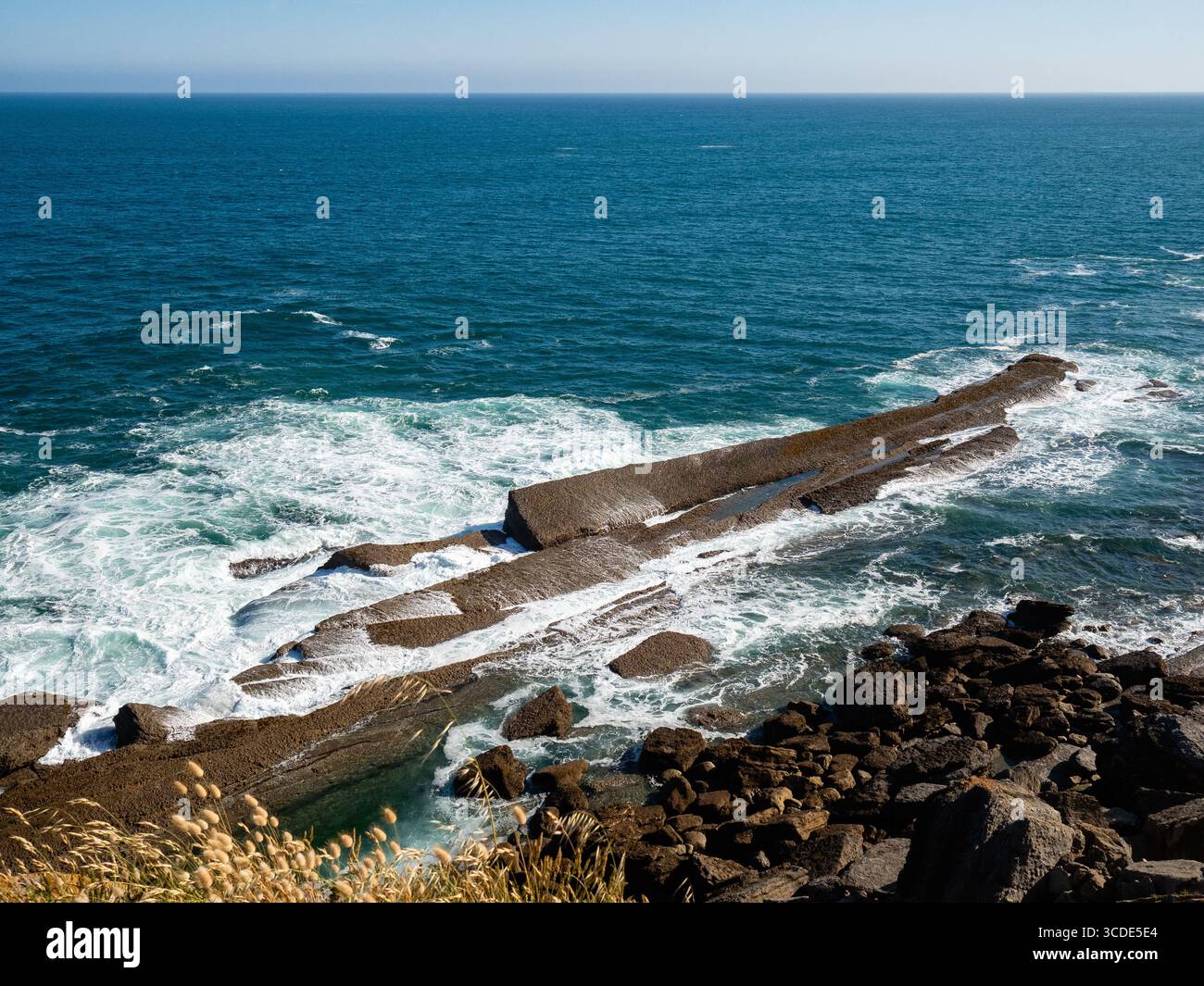 General view of a group of rocks emerging from the sea. The North of ...