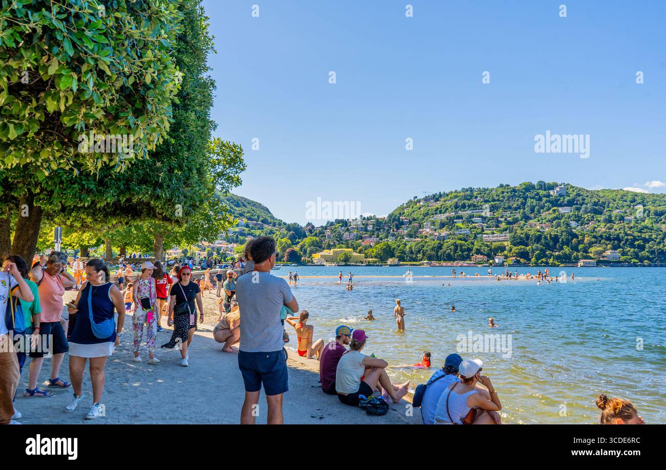 People swim in Lake Como in summer. Swimming is prohibited in Lake Como ...