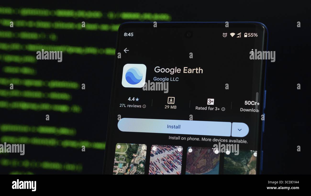 Google Earth app display on a smartphone with a coding background ...