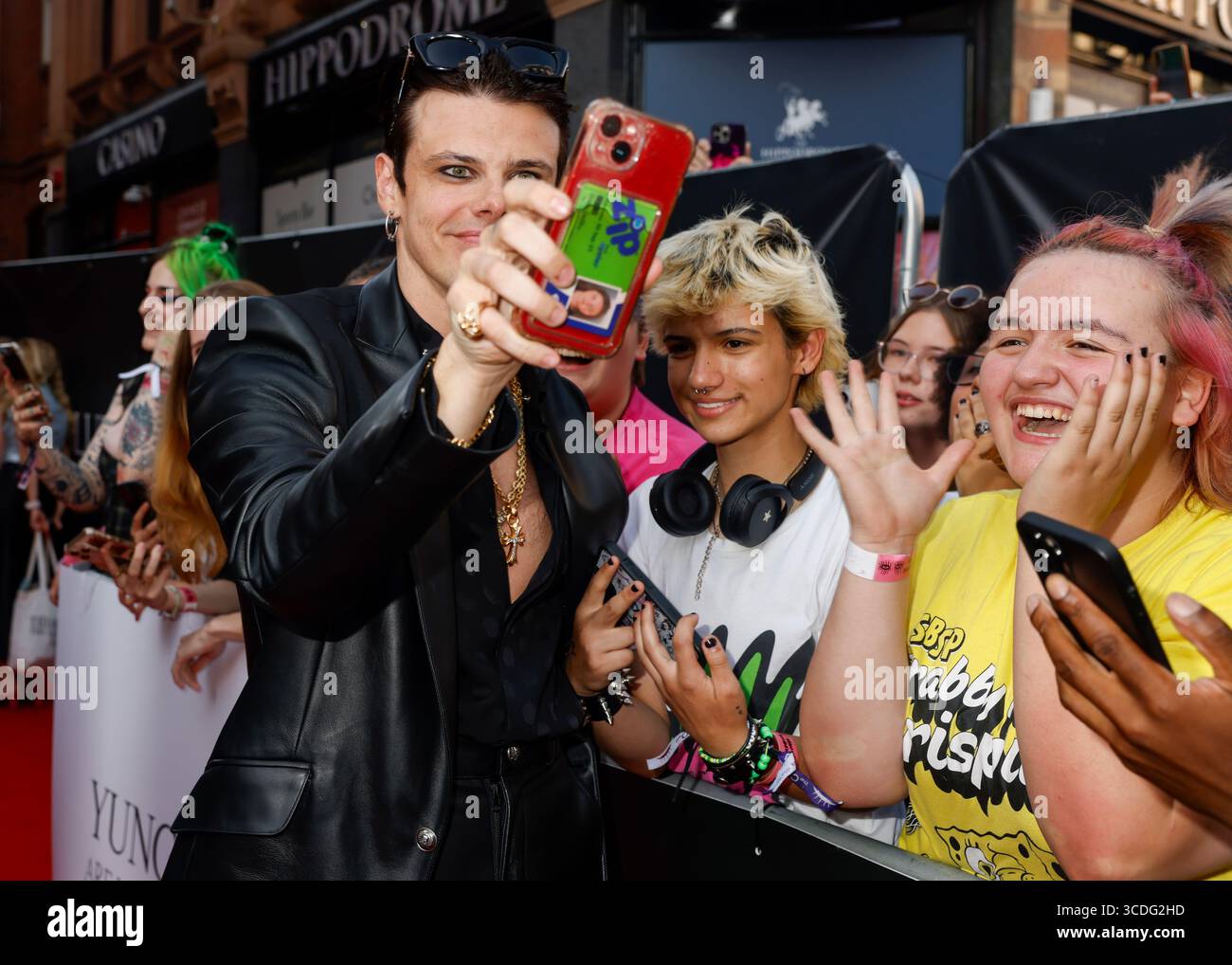 YUNGBLUD aka Dominic Richard Harrison poses with a fan at the YUNGBLUD ...