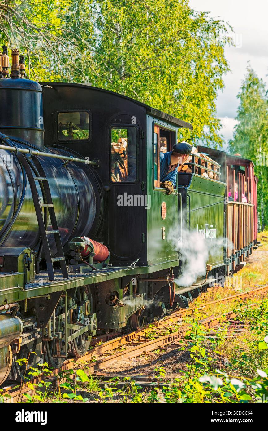 A close-up side view of a vintage steam locomotive from the Jokioinen ...