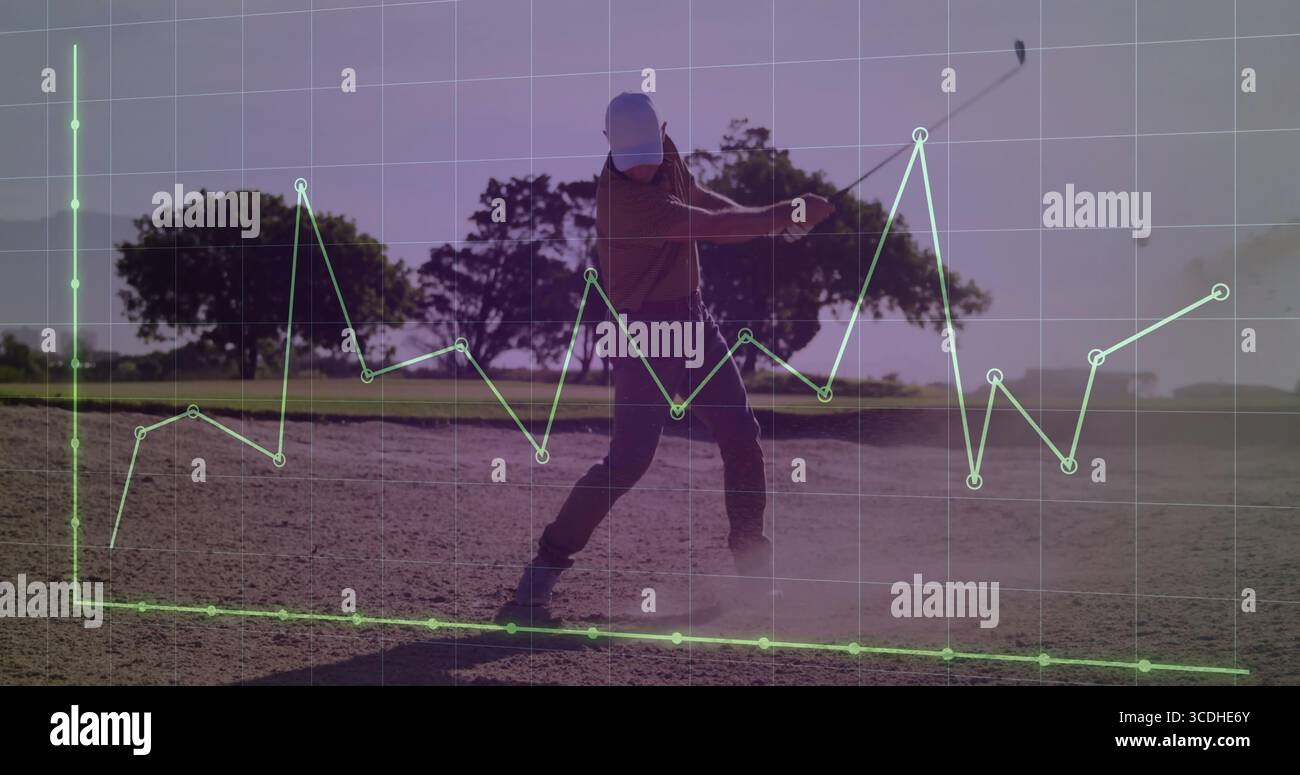 Swinging golfer hitting ball from sand bunker on golf course, with ...
