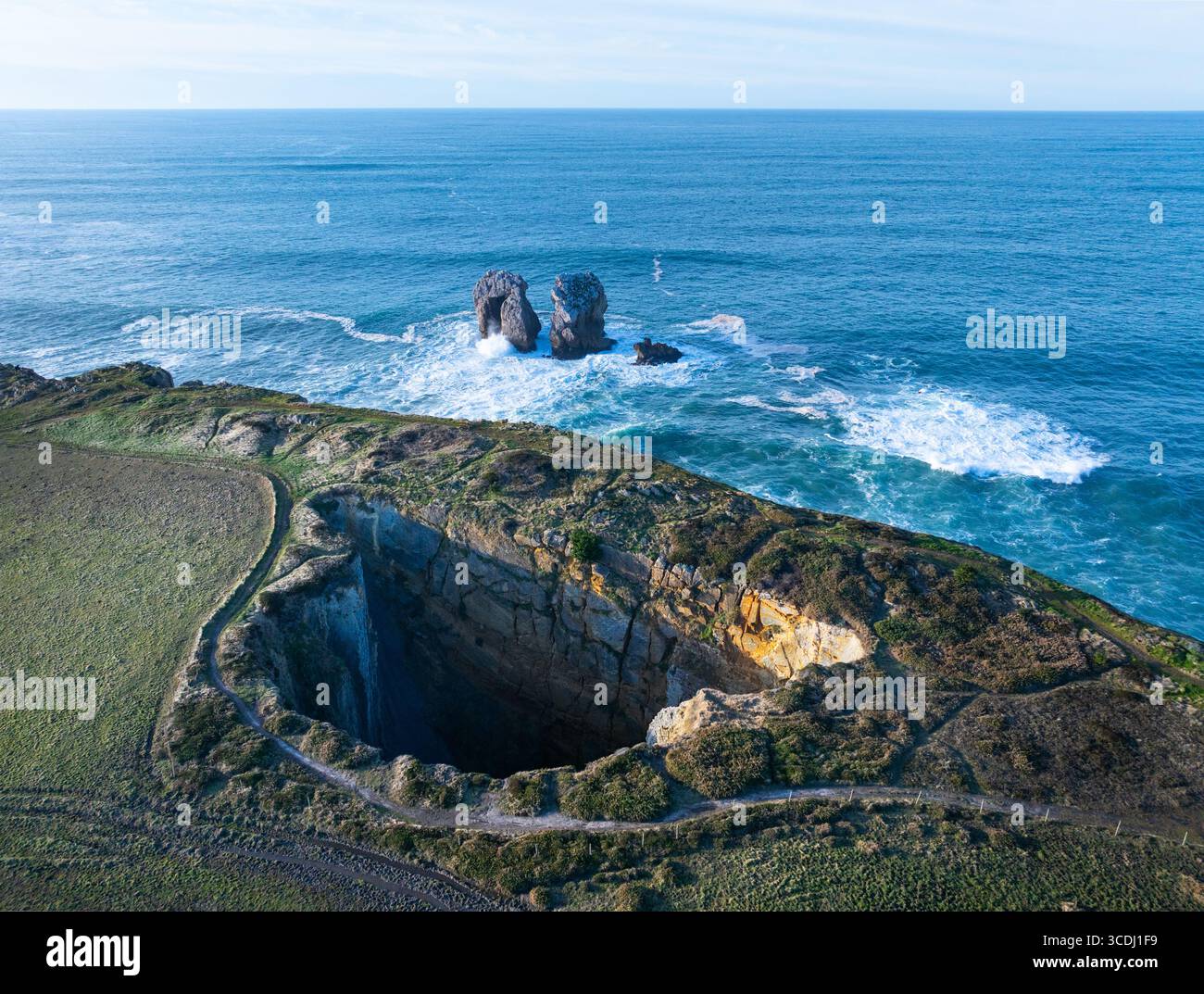 Aerial view from a drone of the Liencres Chasm and the Urro del Manzano ...
