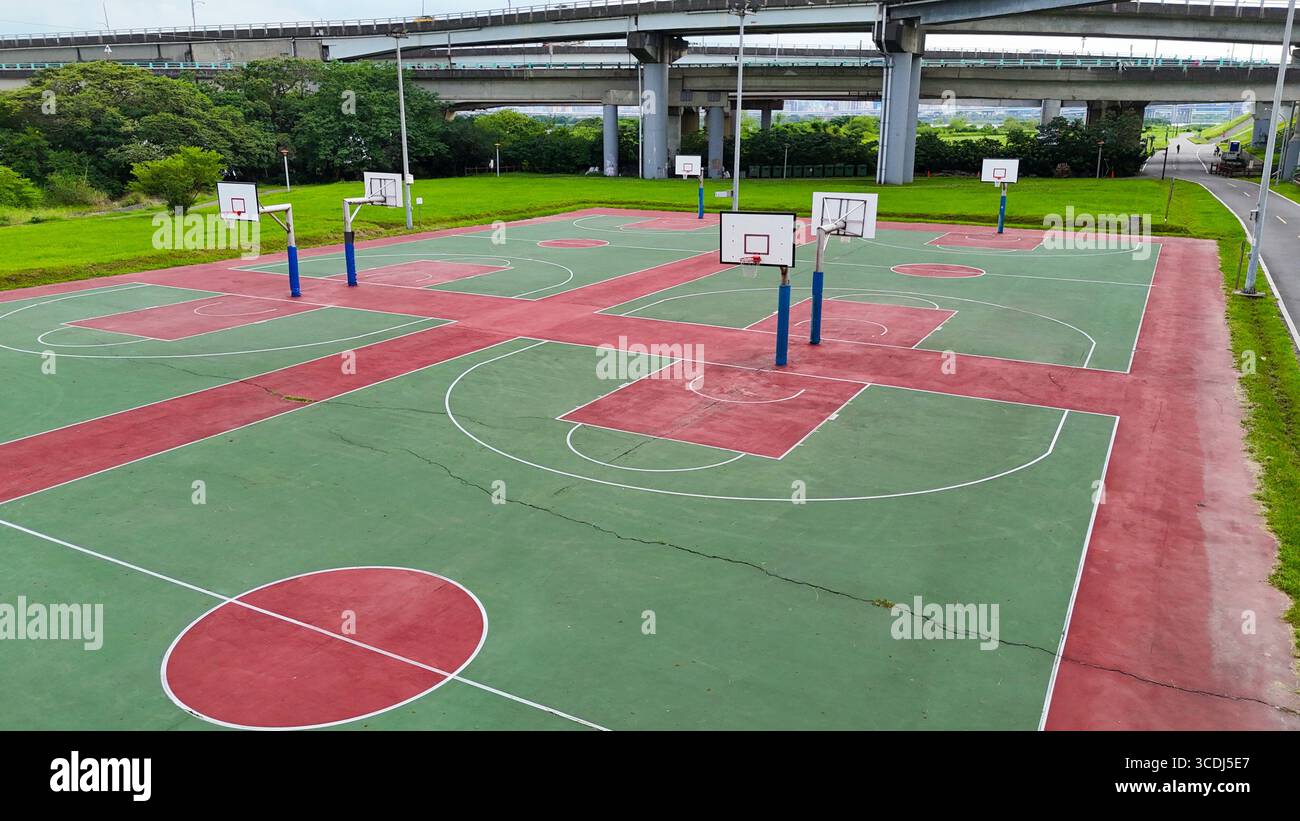 Multiple Outdoor Basketball Courts in a Park Setting Underneath a ...